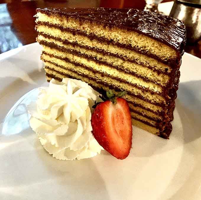 That's not a cake slice, that's an engineering marvel of chocolate layers that defies gravity and common sense.