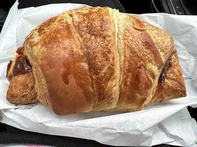 A ham and cheese croissant this golden and flaky should probably come with a warning label for crumb explosion.