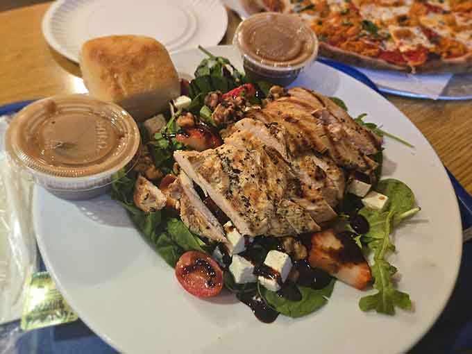 Grilled chicken atop fresh greens proves that even health-conscious choices can look this appetizing and satisfying.