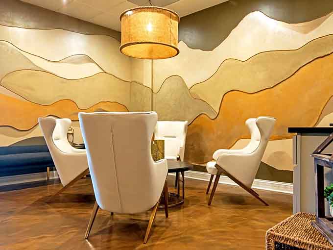 Royal Salt Cave & Spa's lounge area features artistic walls and comfortable seating where pre-treatment anticipation feels almost as good as the treatment.