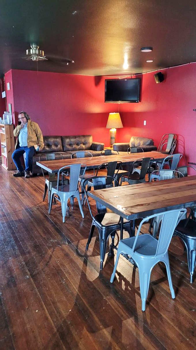 Bold red walls and leather couches create a private party space that's equal parts sophisticated and fun.