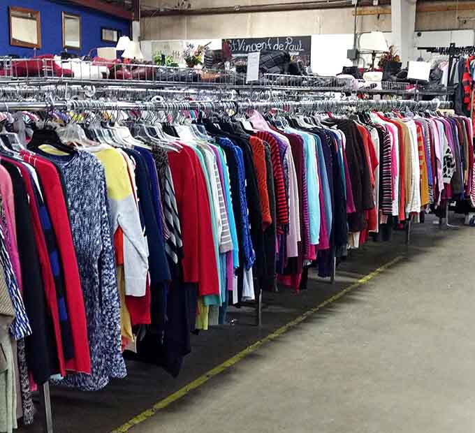 Rows of sweaters stretch endlessly, offering cozy comfort for every season without the guilt of overspending on warmth.