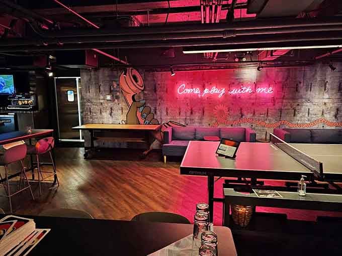 Pink neon lighting sets the mood for friendly competition and possibly questionable paddle grip techniques throughout.