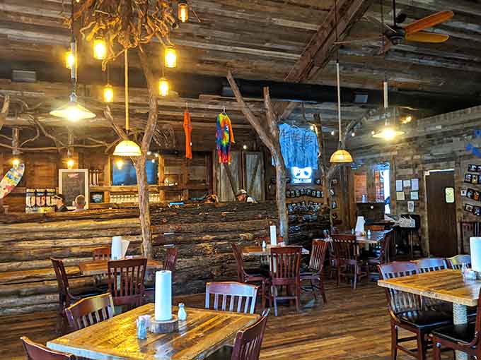 Driftwood accents and pendant lights dangling from cathedral ceilings create an atmosphere that's equal parts rustic and refined throughout.