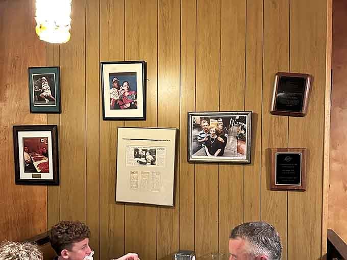 Framed memories line the walls, telling decades of stories about New Haven's pizza royalty.
