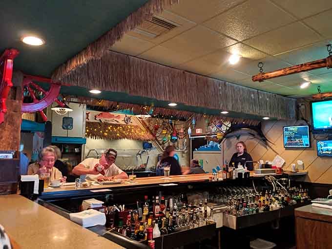 The bar area goes all in on the beach theme, making tropical cocktails feel perfectly natural here.
