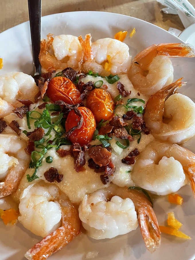 Shrimp and grits topped with bacon and scallions, because the South knows how to treat its seafood right.