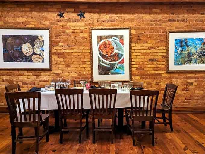 Framed food photography on exposed brick walls reminds you that eating is an art form worth celebrating properly.