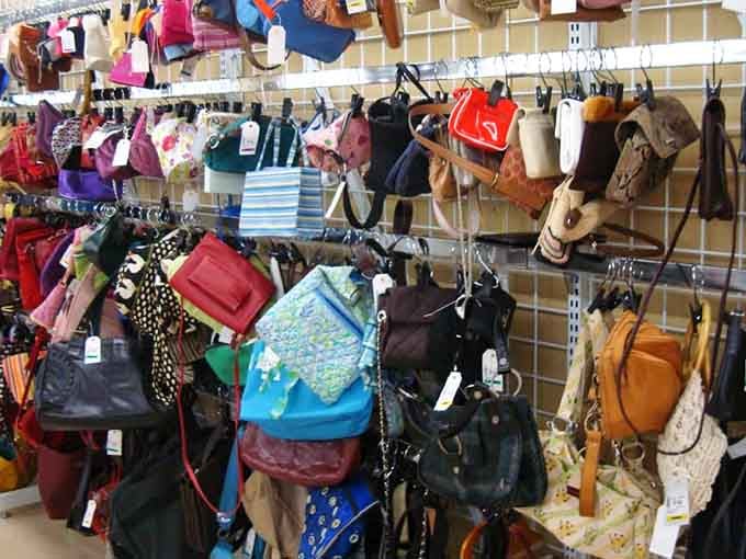 Handbags hanging like fashion possibilities, each one with its own story and significantly lighter price tag than retail.