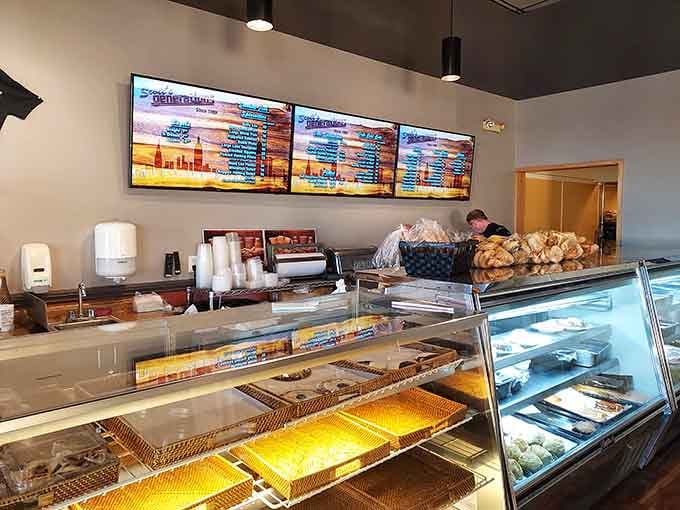 The bakery case and counter setup makes ordering feel like choosing treasures from a delicious museum.