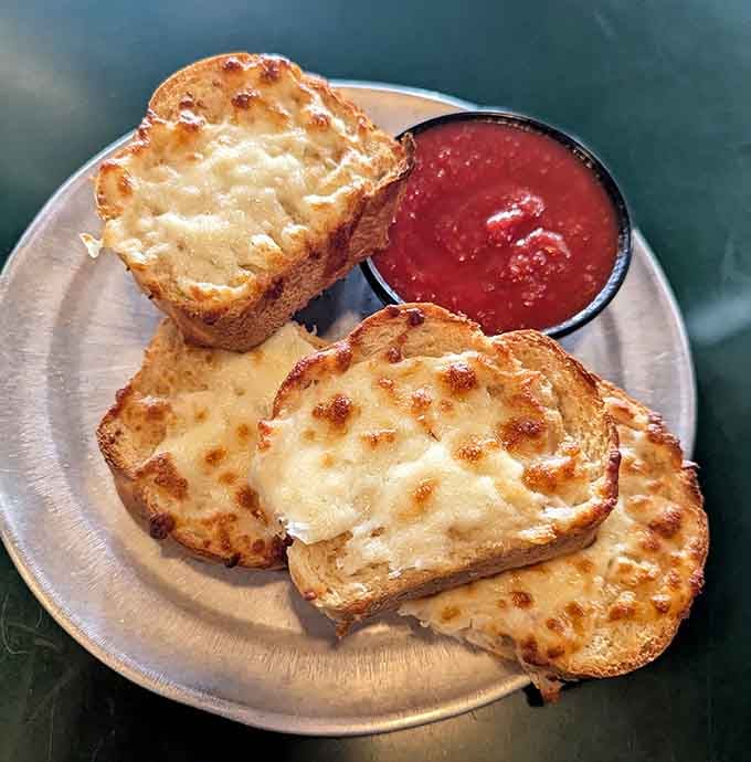 Garlic cheese bread with marinara: the opening act that sometimes steals the show from the headliner.