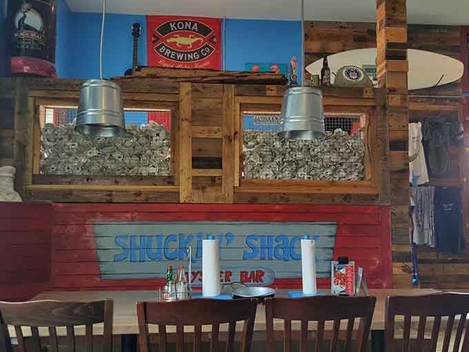 Rustic wood, oyster shells, and brewing company signs create an authentically beachy dining atmosphere.