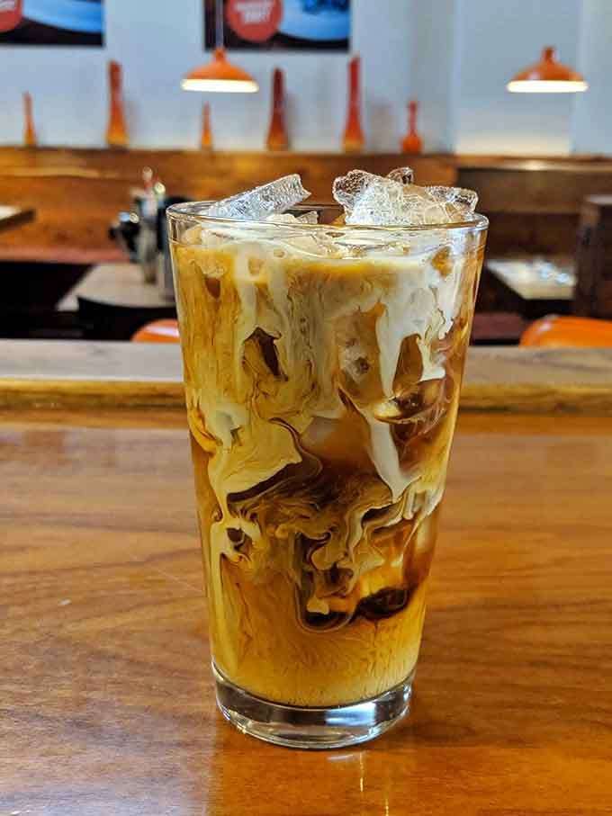 Swirling cream through iced coffee creates mesmerizing patterns that almost distract from how delicious it tastes, almost.