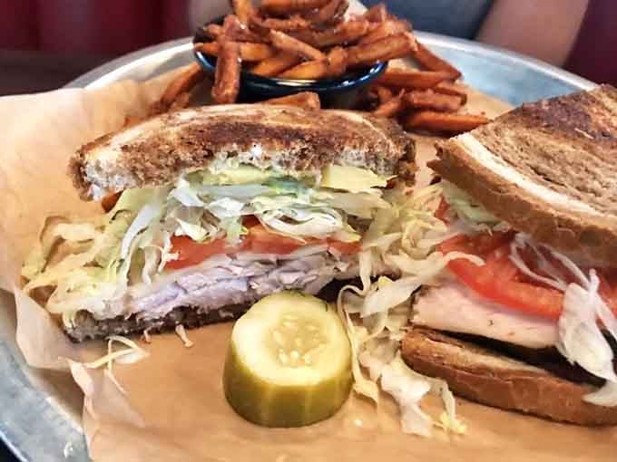 This turkey bacon club stacked high with slaw shows sandwiches can be architectural marvels worth photographing.