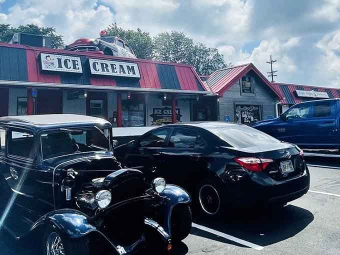 Classic cars in the parking lot feel right at home, like they've finally found their natural habitat.