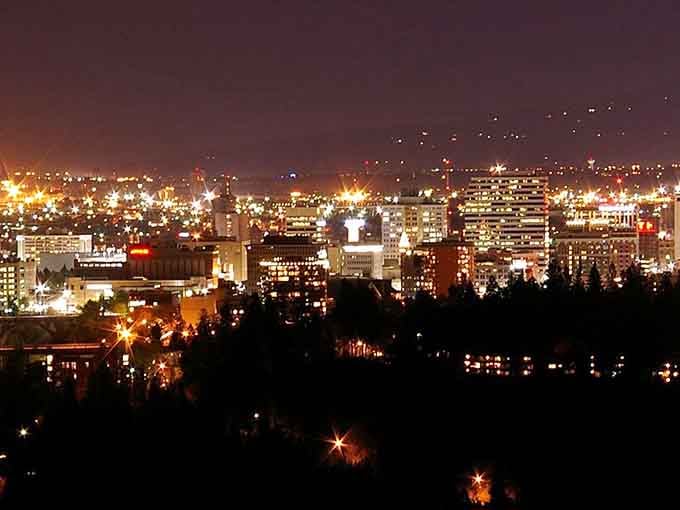 City lights twinkle across the valley at night, creating million-dollar views for thousand-dollar budgets.