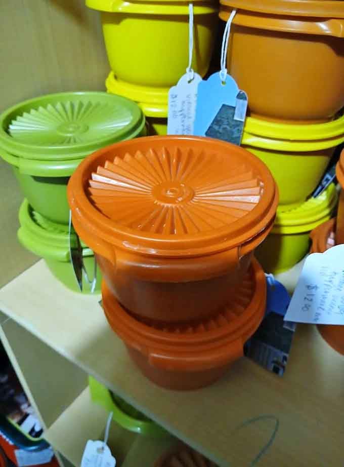 Vintage Tupperware in colors that scream 1970s optimism, back when avocado green was considered sophisticated interior design.