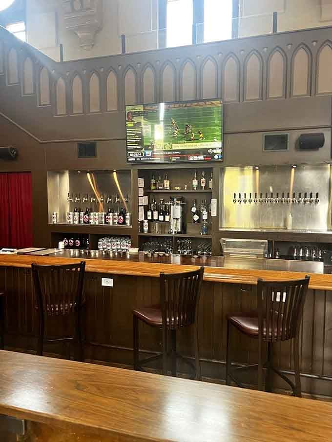 The bar area showcases an impressive tap selection beneath architectural details that remind you where you're drinking.