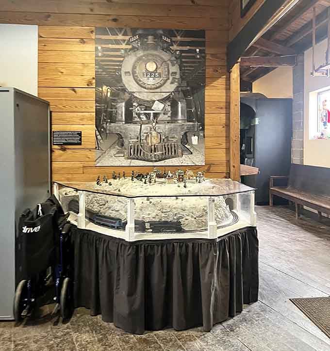 This intricate model railroad display captures the magic of steam railroading in miniature, complete with tiny billowing smoke effects.