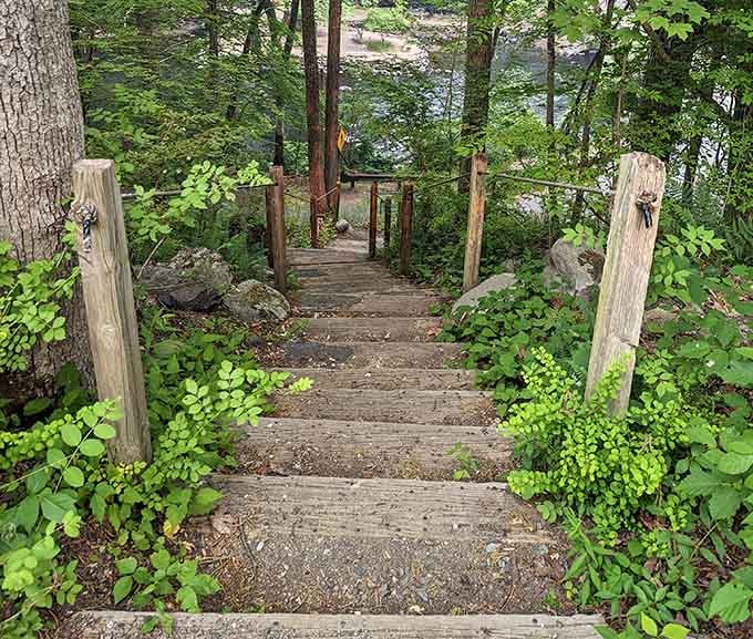 Wooden stairs leading down to the river promise adventure without requiring a sherpa or oxygen tank to navigate.