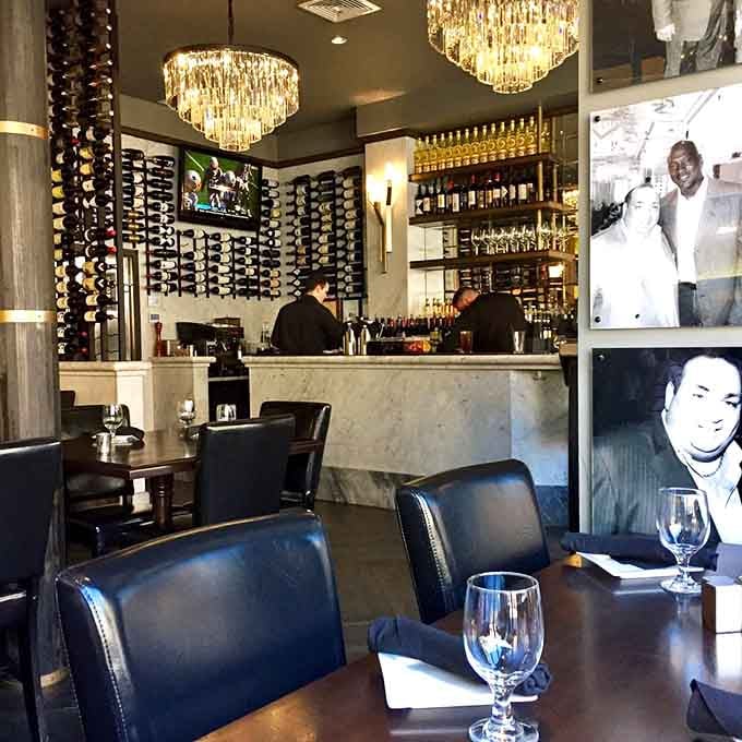 Floor-to-ceiling wine displays and marble bar tops suggest someone here takes their beverage program as seriously as dinner.