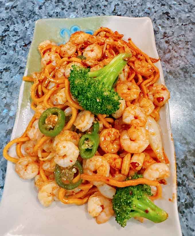 Spicy shrimp stir-fry with broccoli and peppers adds some heat to your seafood marathon, keeping things interesting.
