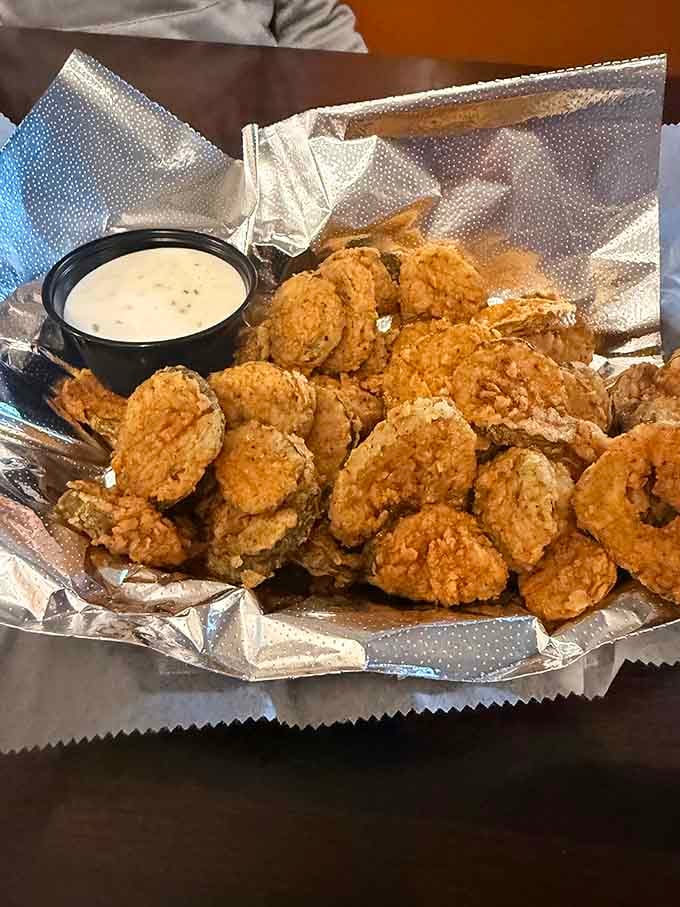 Golden fried pickles with dipping sauce, because even crime fighters need their vegetables, sort of anyway.