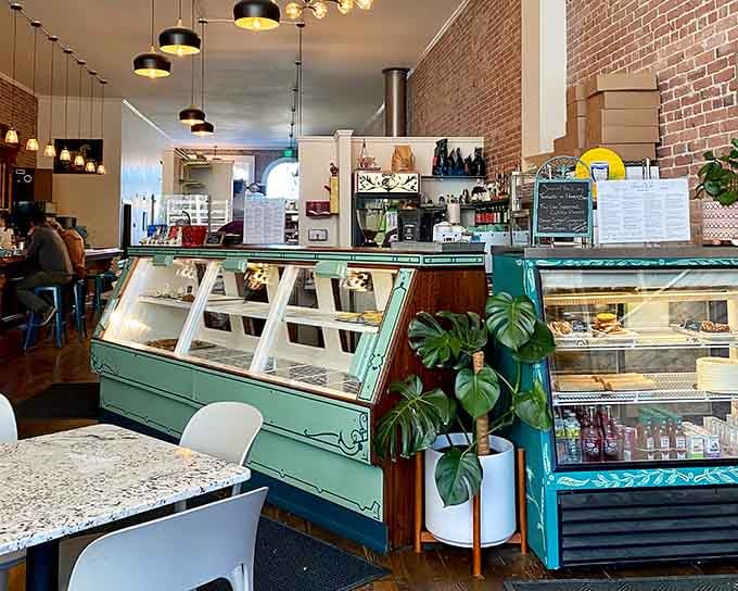 The long view reveals artwork, seating, and that magnificent bar beckoning you to stay awhile longer.