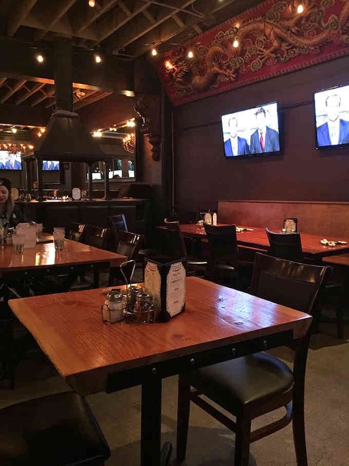 Dark wood and warm lighting create the perfect backdrop for contemplating your life choices, one massive slice at a time.