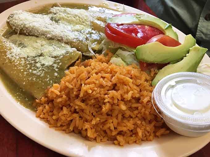 Green enchiladas smothered in salsa verde, proving that comfort food transcends all cultural boundaries when done this well.