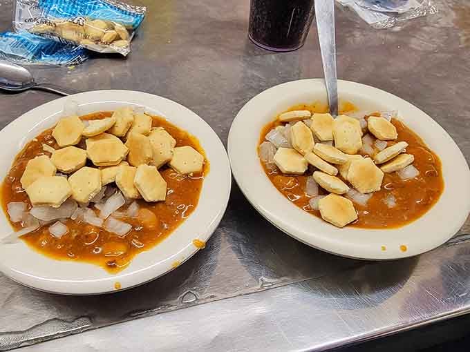 The Bowl: chili, beans, onions, and crackers in perfect harmony, like a comfort food symphony in a dish.