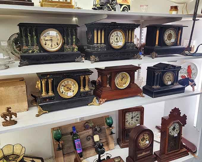 Antique clocks line the shelves like a timeline of timekeeping, each one ticking toward its next home.