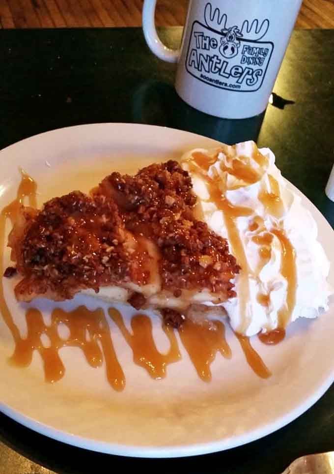 Apple pie with caramel drizzle and whipped cream, because subtlety is overrated when dessert is this good looking.