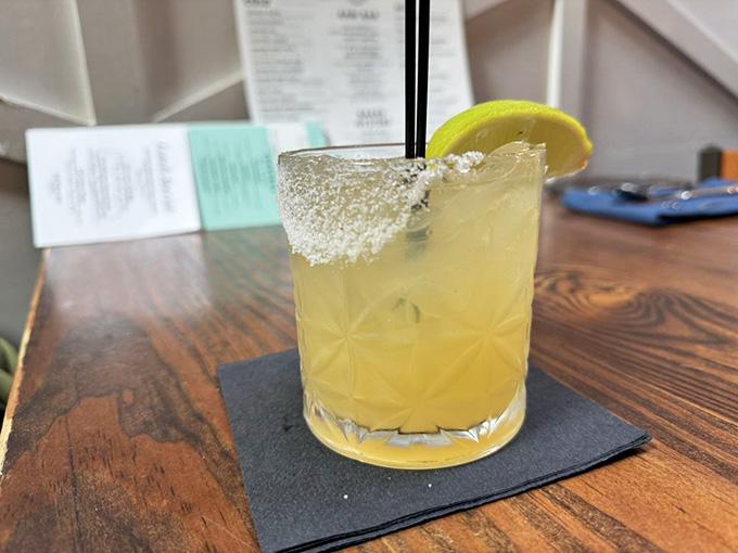 A classic margarita with a salted rim, the perfect companion to your coastal dining experience today.