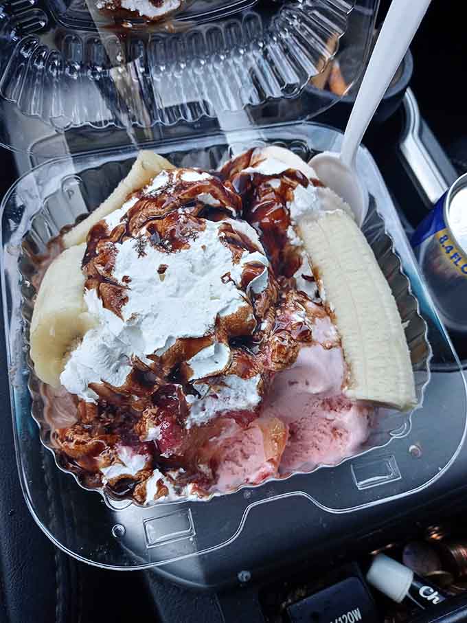 Banana split drizzled with chocolate and whipped cream, making every diet start officially tomorrow instead of today.