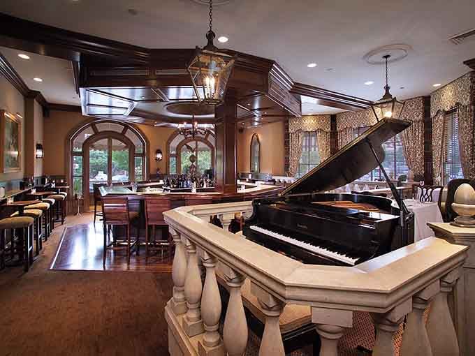 A grand piano sets the mood while the bar beckons, because sophistication should always feel inviting.