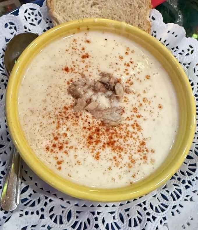 She Crab Soup served in a cheerful yellow bowl offers creamy comfort that warms you from inside out.