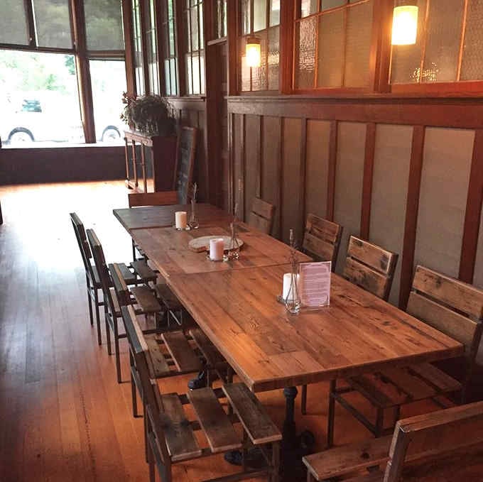 Long communal tables and natural light create the kind of welcoming atmosphere that keeps people coming back.