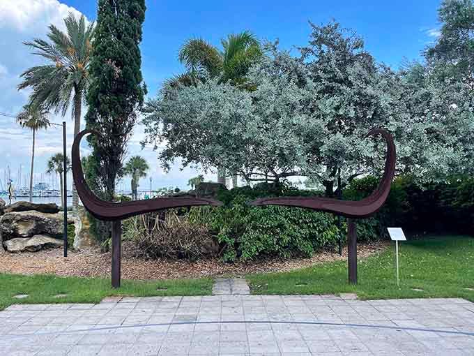 Salvador Dal&iacute;'s iconic mustache immortalized in sculpture form, defying gravity just like the man himself did.