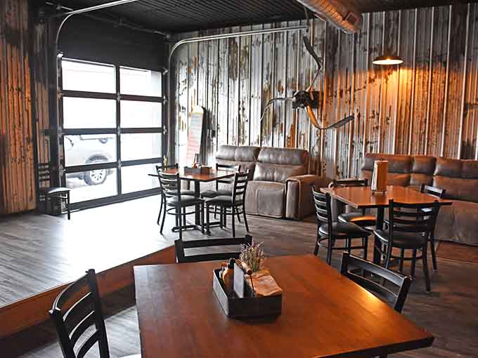 Corrugated metal walls and vintage aircraft create an atmosphere that's equal parts nostalgia and genuine cool factor.