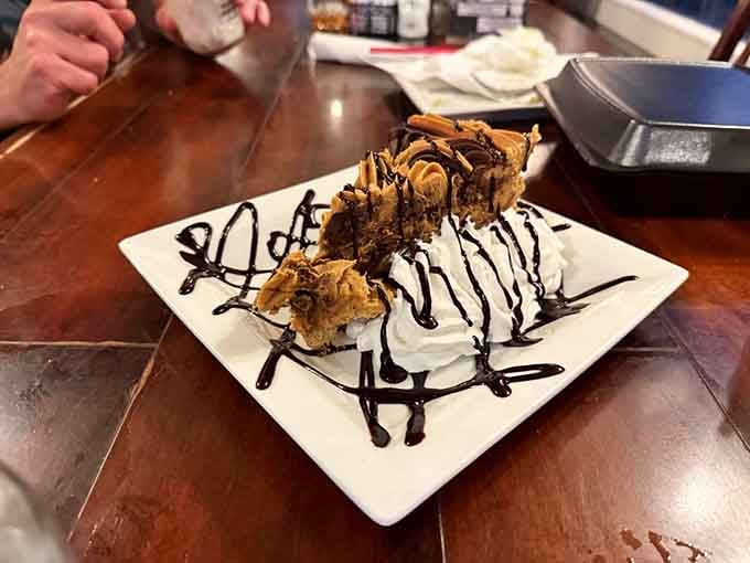 Peanut butter chocolate pie with enough whipped cream to make your cardiologist nervous and your taste buds ecstatic.