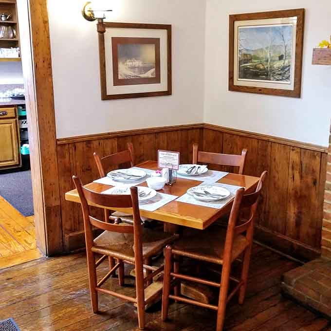 Wood paneling and framed landscapes create that authentic farmhouse atmosphere money simply cannot buy or fake.