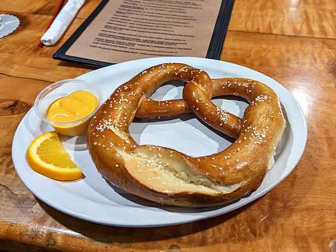 A giant Bavarian pretzel with mustard proves that sometimes the best appetizers are the simplest ones done right.
