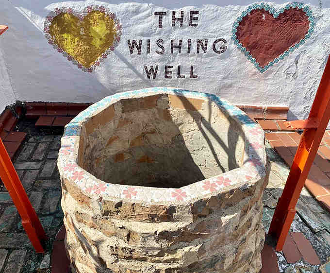 The Wishing Well awaits your dreams, nestled among tiles and hearts in this citrus-themed wonderland.