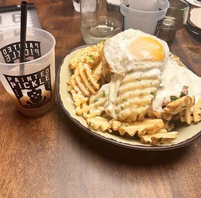 Fundido waffle fries topped with a fried egg is the kind of genius that changes lives forever.