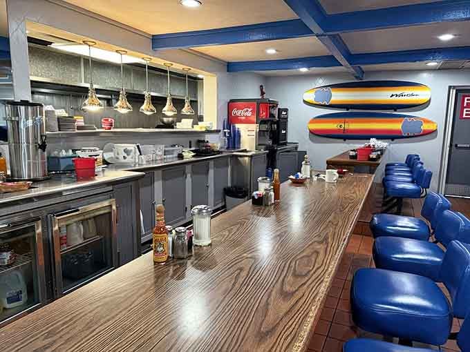 Counter seating with a front-row view of pancake production, because sometimes you need to see greatness being made.