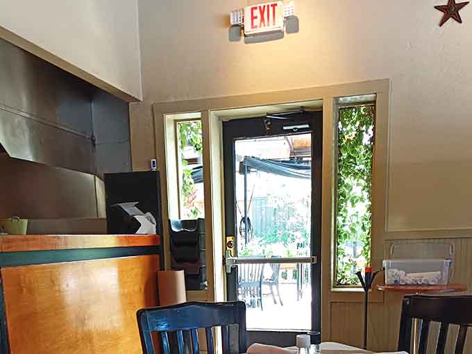 Natural light streams through the exit, reminding you there's a whole world outside, though you might not want to leave.