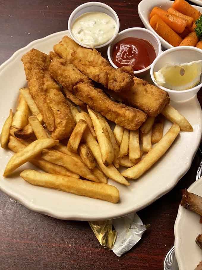 Classic fish and chips done right, with golden breading that stays crispy and tartar sauce that knows its supporting role perfectly well.