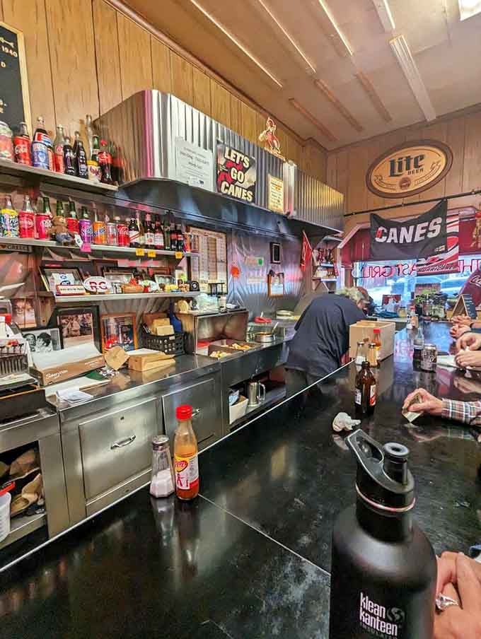 Watch the masters at work behind this counter where efficiency meets decades of hot dog wisdom and practice.