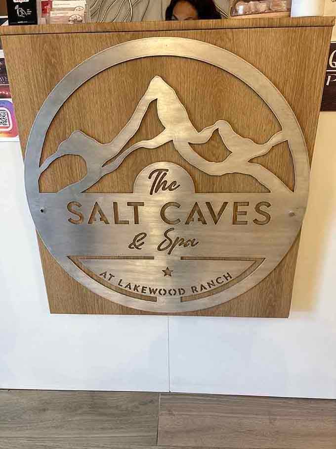 The wooden Salt Caves logo at reception sets the tone: natural, earthy, and refreshingly free of corporate sterility.
